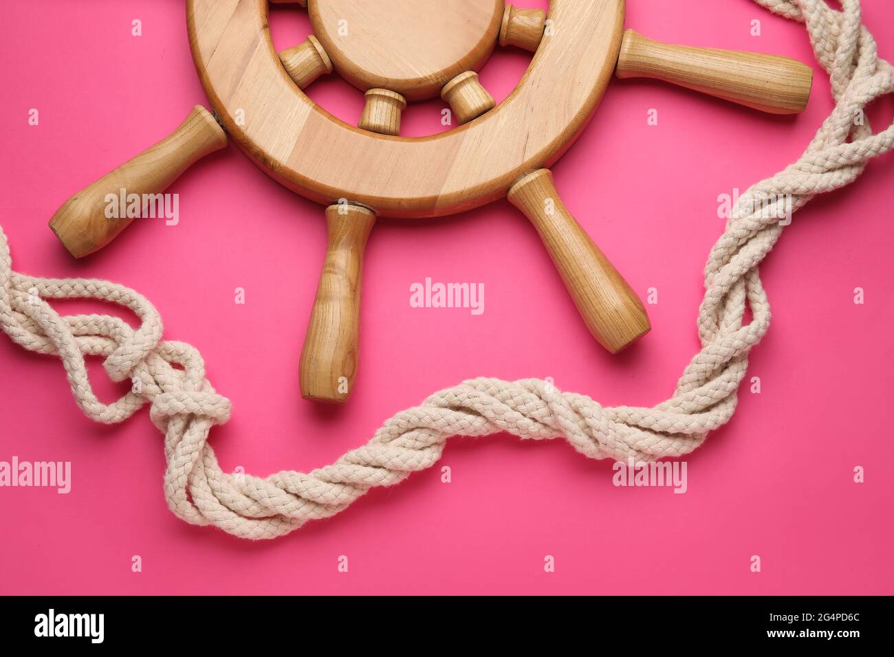Helm and rope on color background Stock Photo - Alamy