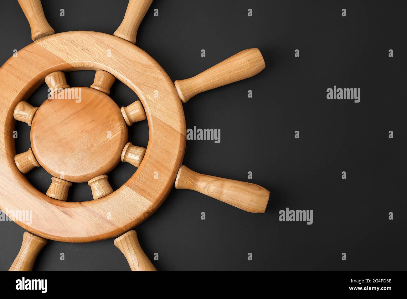 Ship helm on dark background Stock Photo - Alamy
