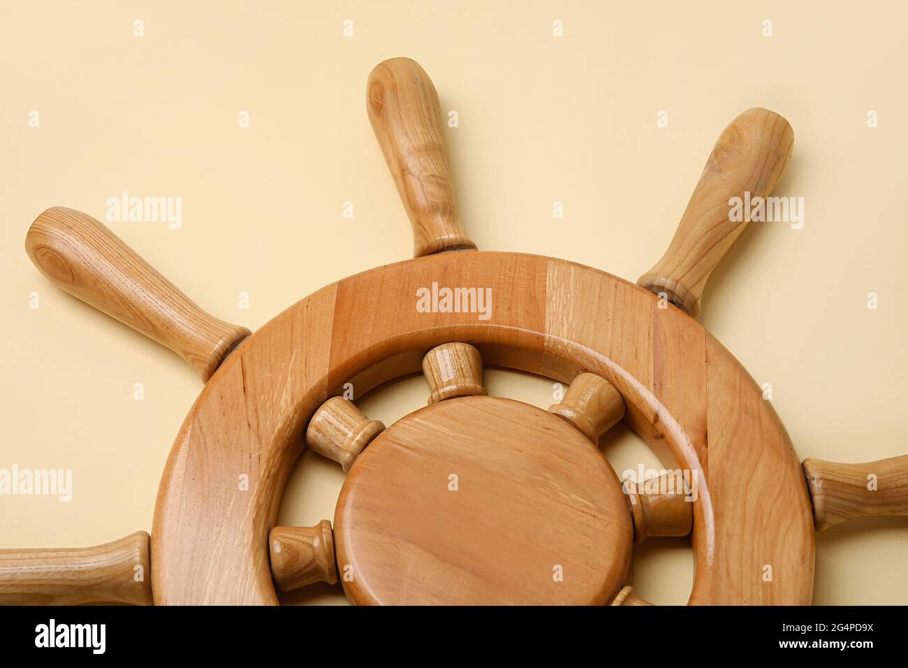 Ship helm on color background Stock Photo - Alamy