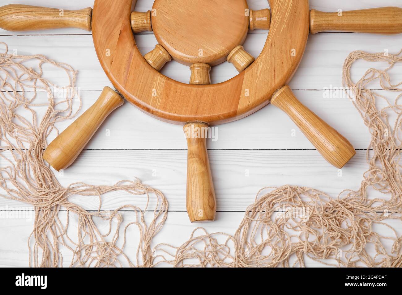 Helm and net on white wooden background Stock Photo - Alamy