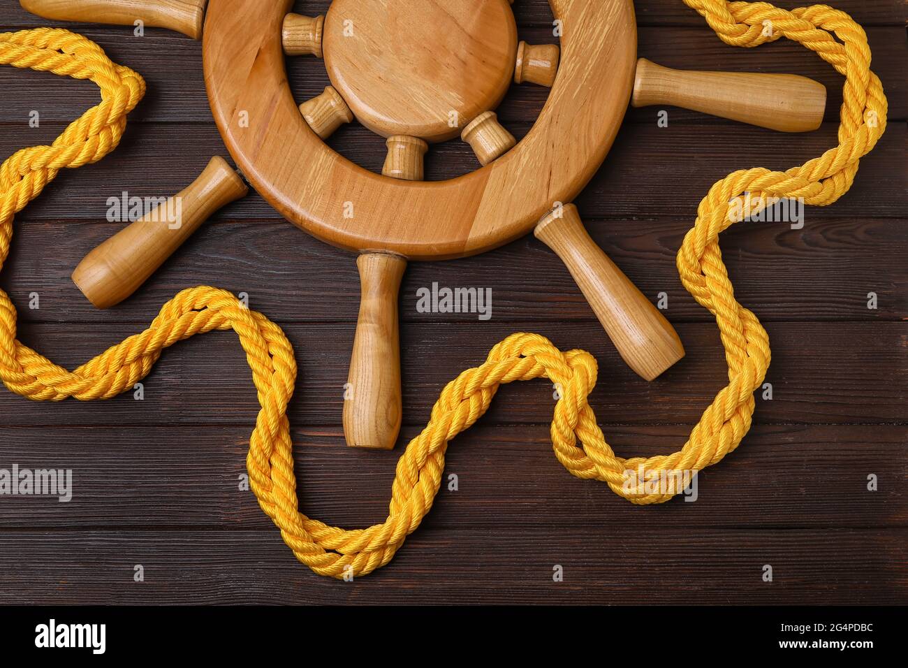 Helm and rope on wooden background Stock Photo - Alamy