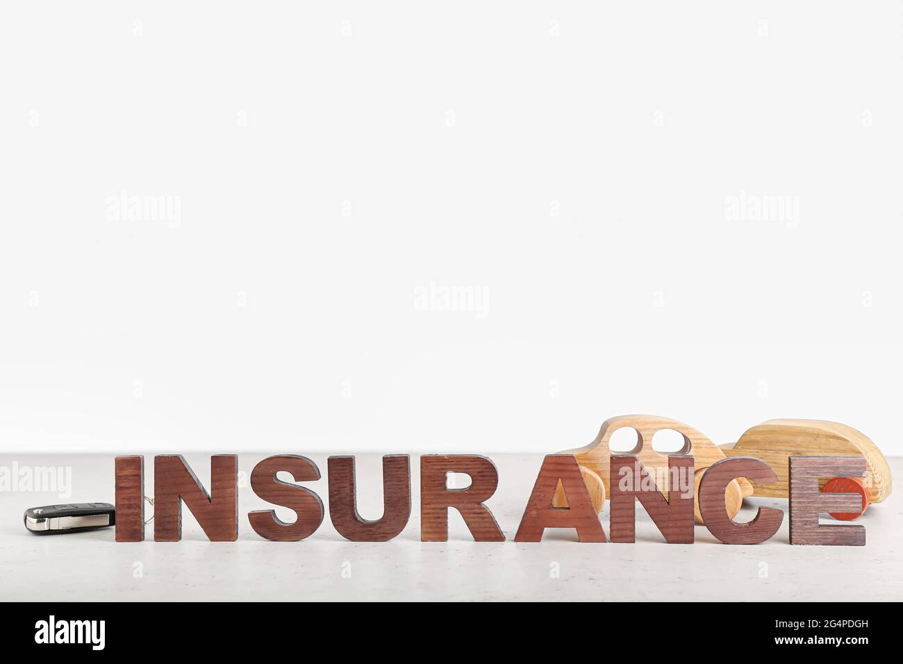 Word INSURANCE with key and car figures on white background Stock Photo ...