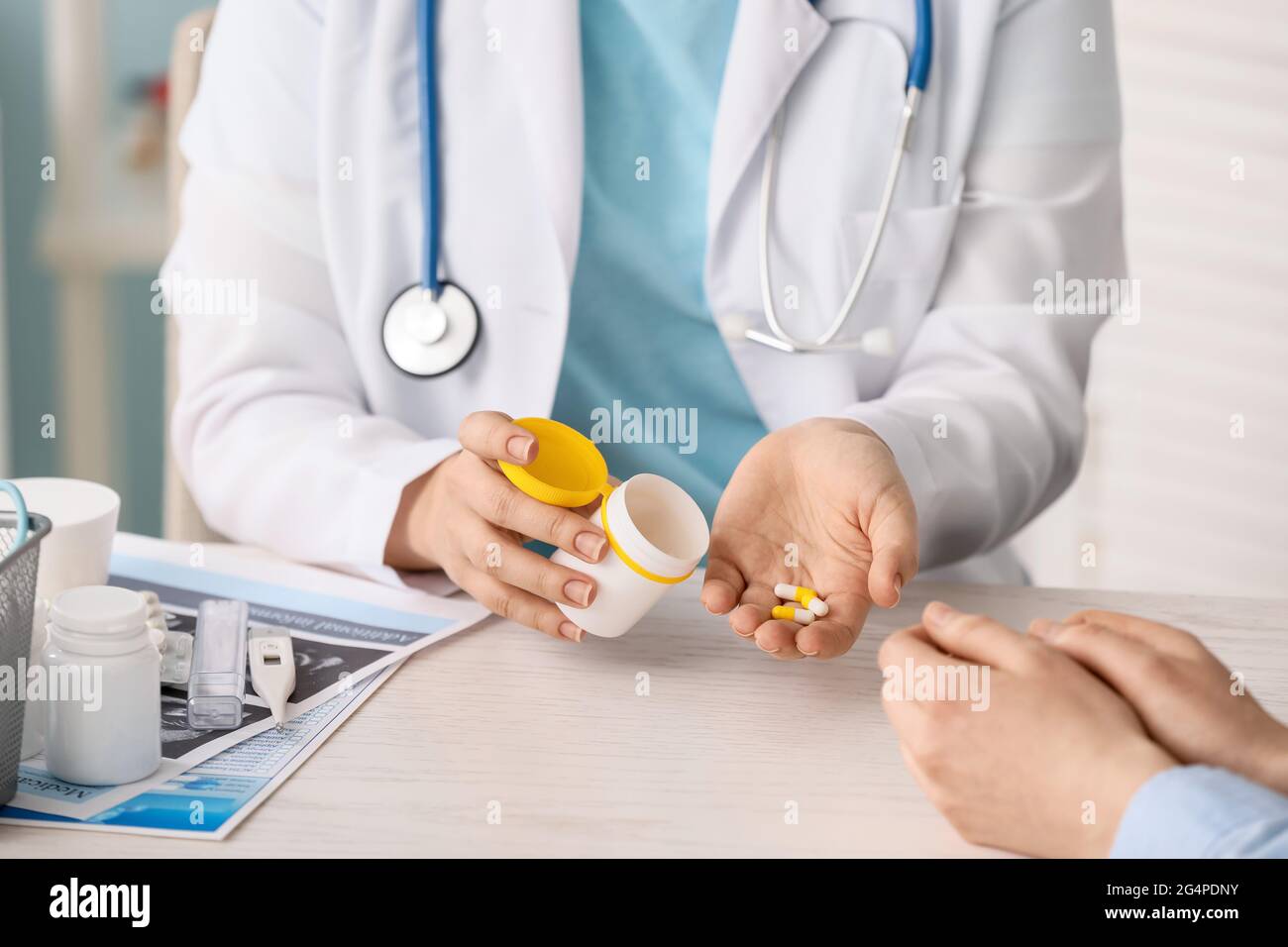 Female doctor giving medicine to patient in clinic, closeup Stock Photo ...