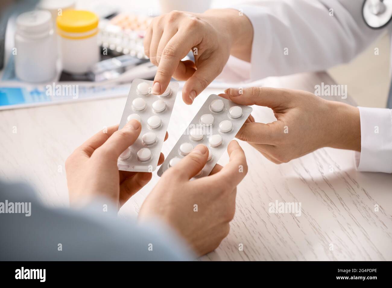 Female doctor giving medicine to patient in clinic, closeup Stock Photo ...