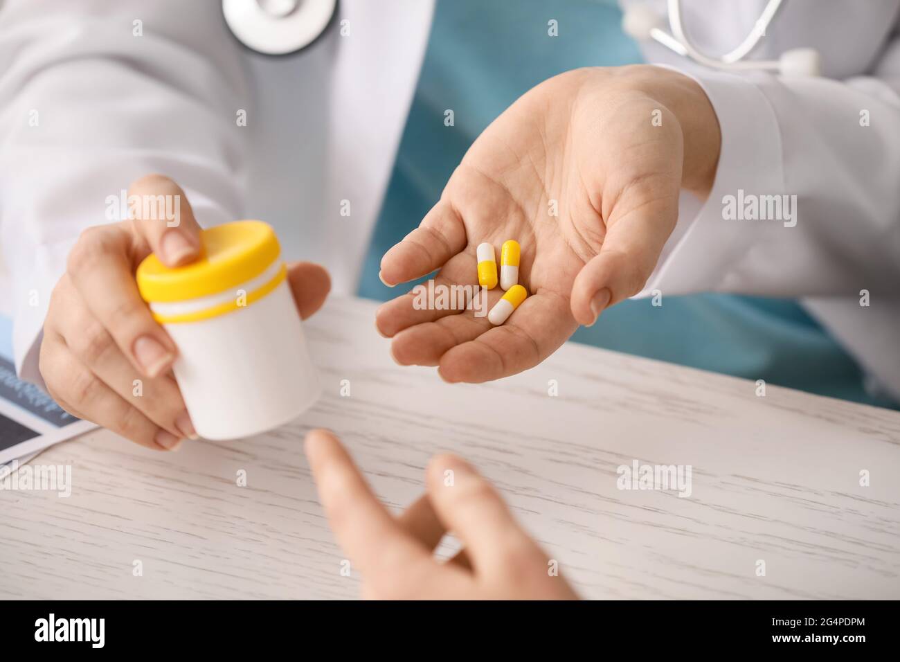 Female doctor giving medicine to patient in clinic, closeup Stock Photo ...