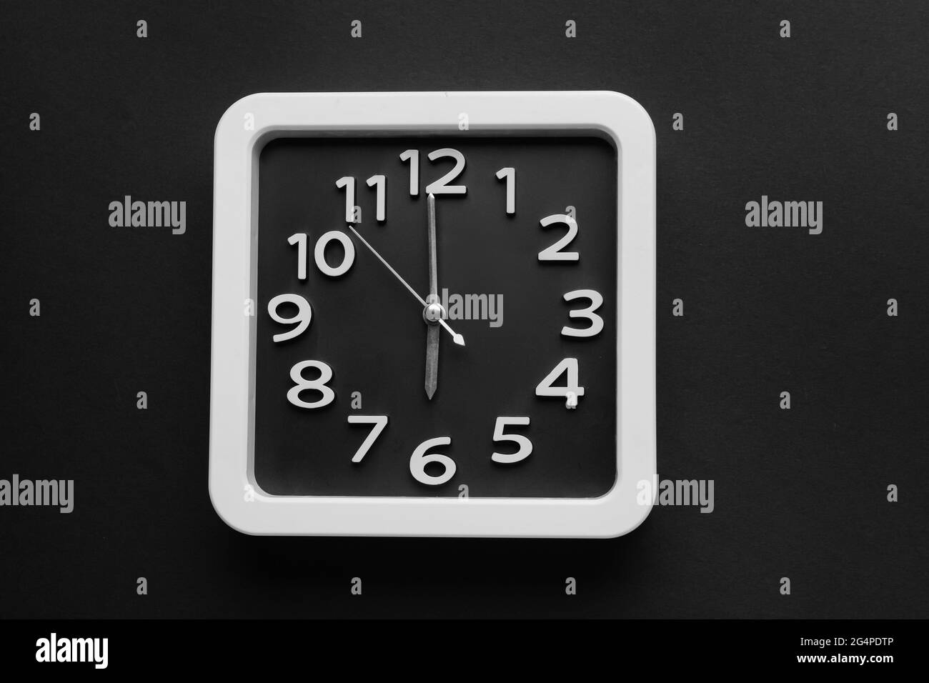 Stylish clock on dark background Stock Photo - Alamy