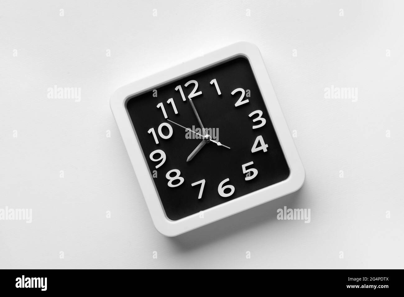 Stylish clock on light background Stock Photo - Alamy