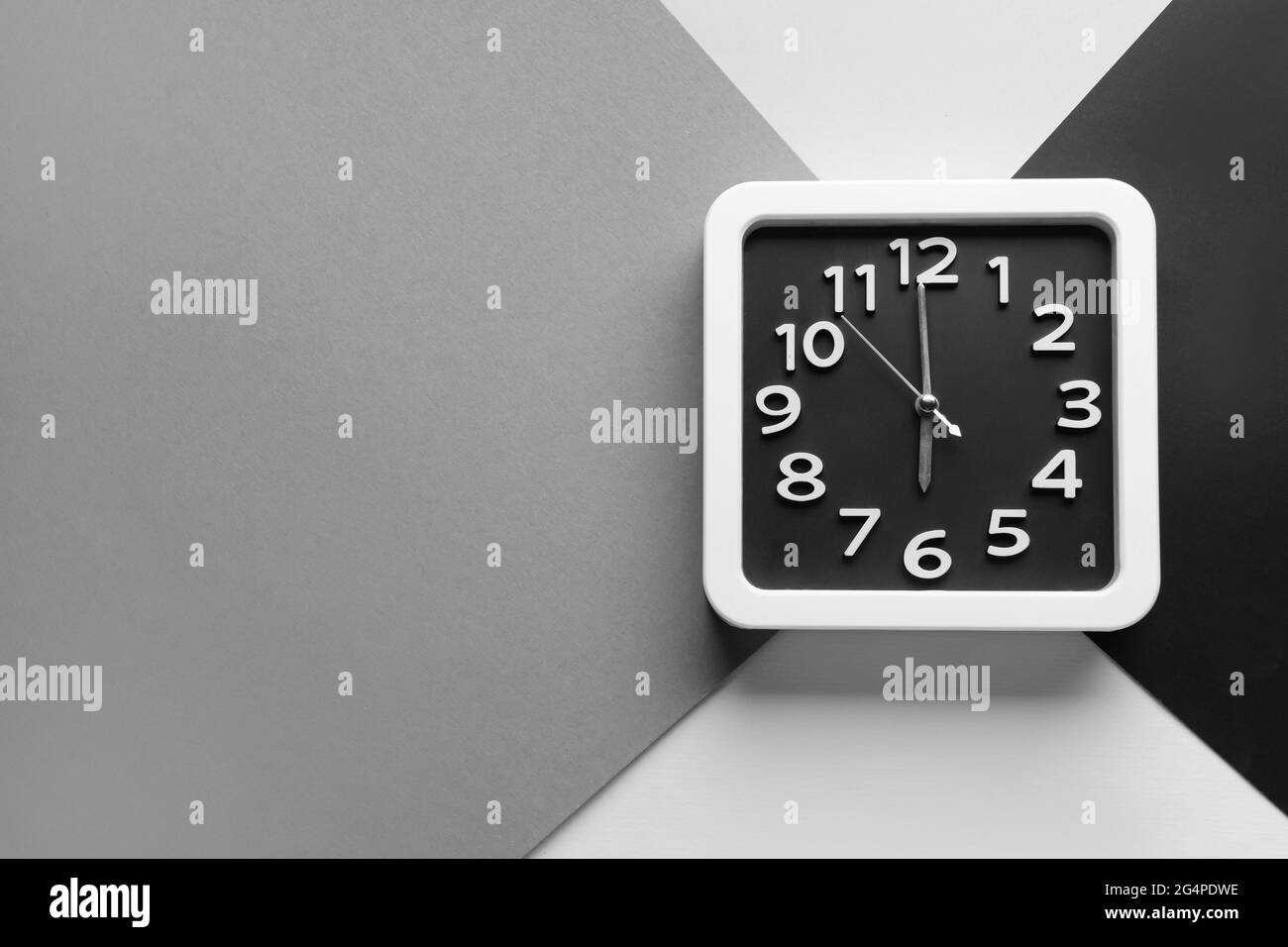 Stylish clock on color background Stock Photo - Alamy