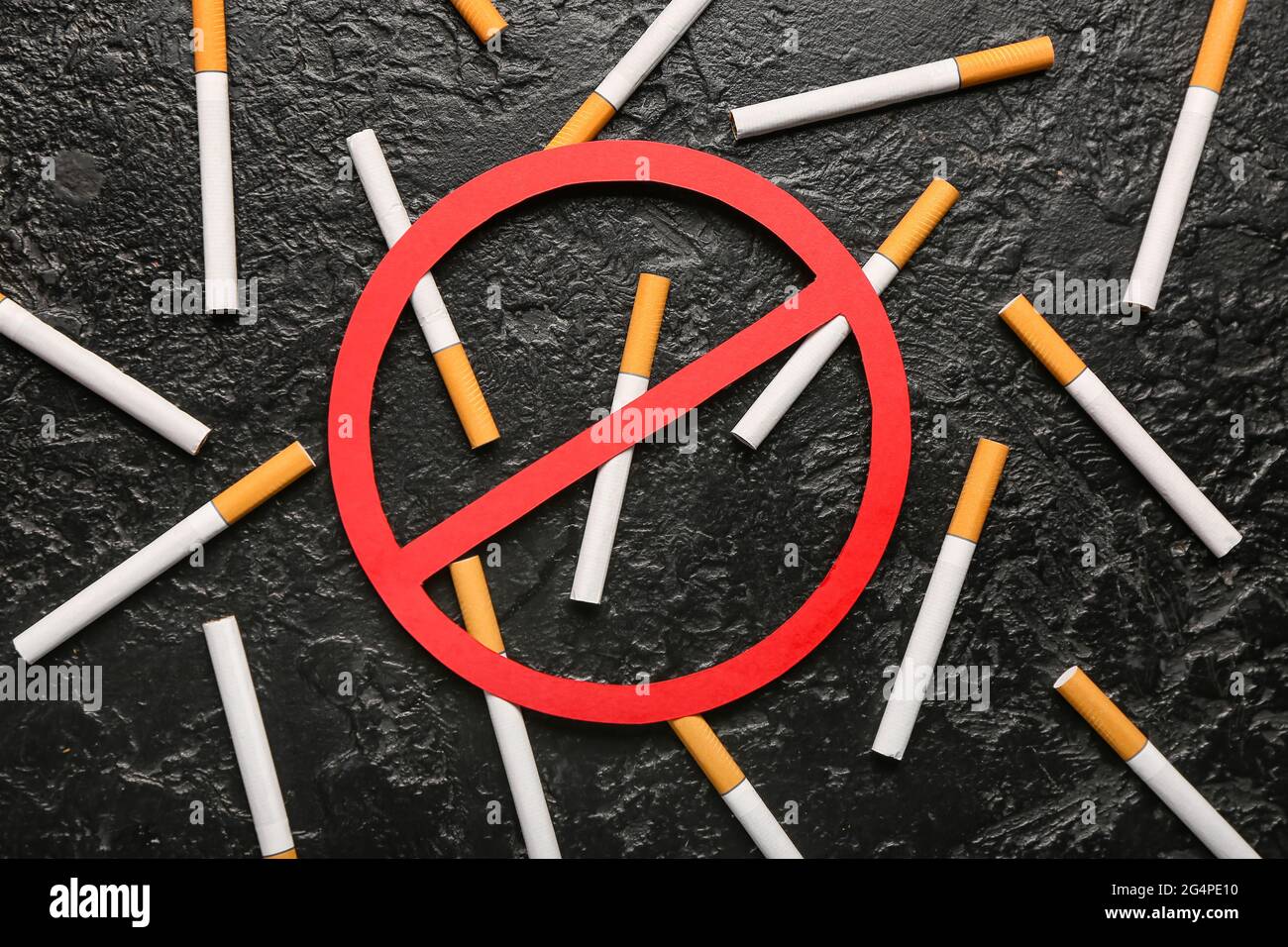 STOP sign and cigarettes on dark background Stock Photo - Alamy