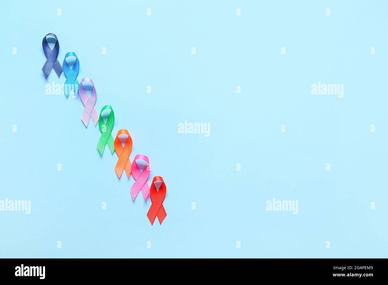 Different awareness ribbons on color background Stock Photo - Alamy