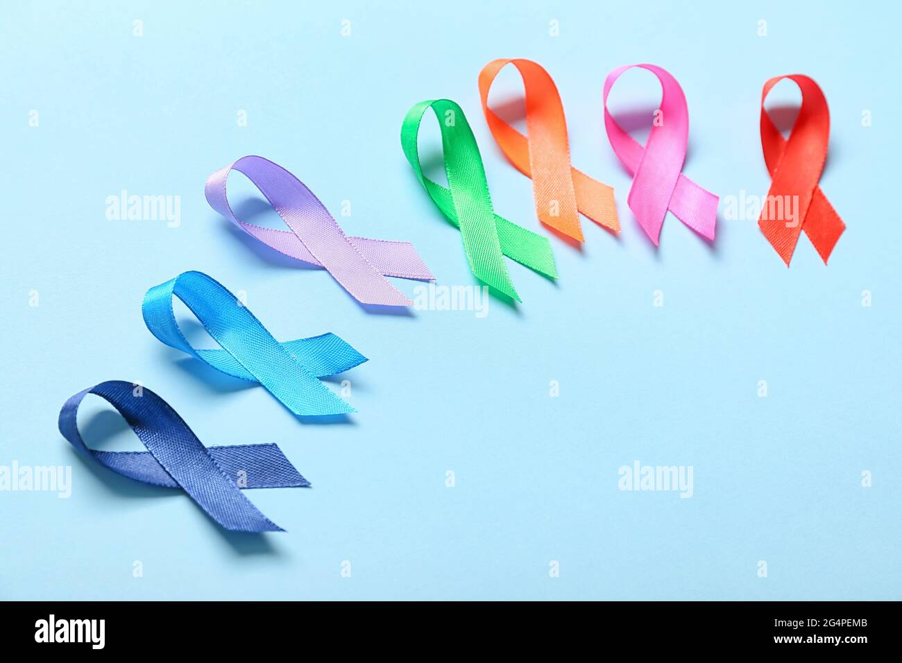 Different awareness ribbons on color background Stock Photo - Alamy