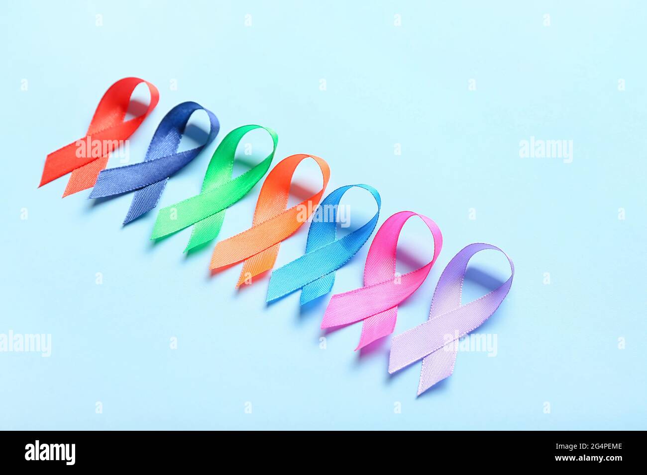 Different awareness ribbons on color background Stock Photo - Alamy