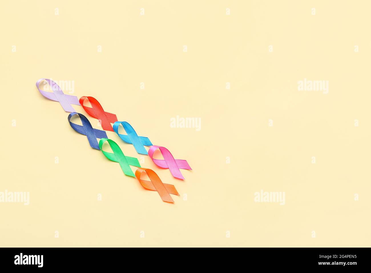 Different awareness ribbons on color background Stock Photo - Alamy