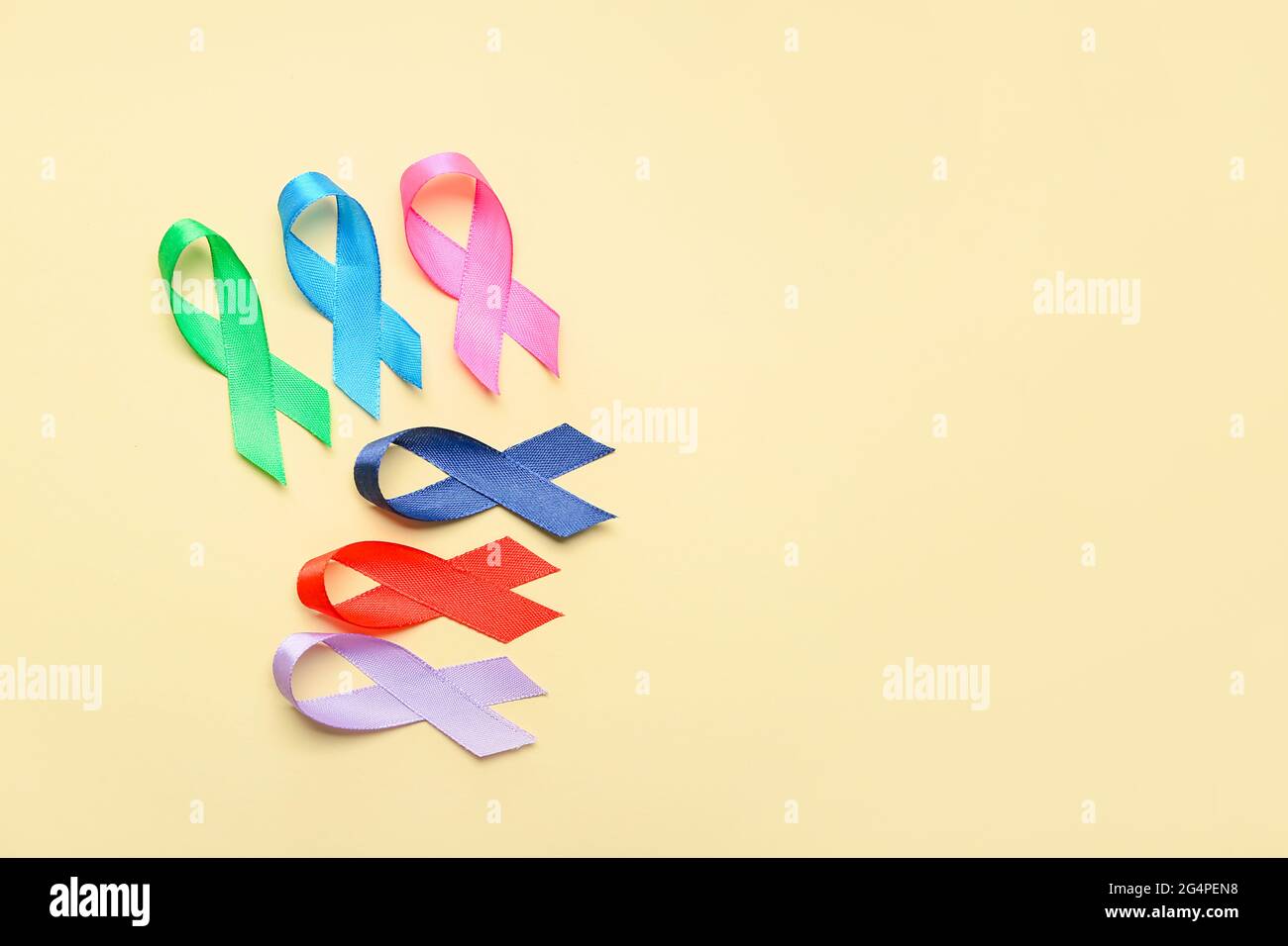 Different awareness ribbons on color background Stock Photo - Alamy