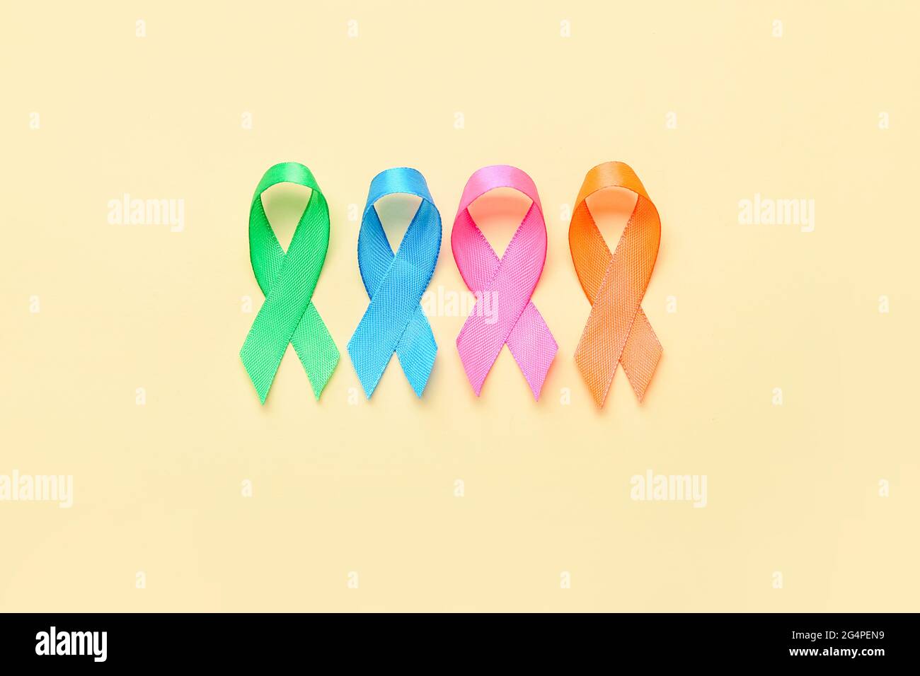 Different awareness ribbons on color background Stock Photo - Alamy