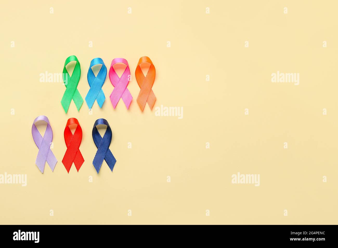 Different awareness ribbons on color background Stock Photo - Alamy