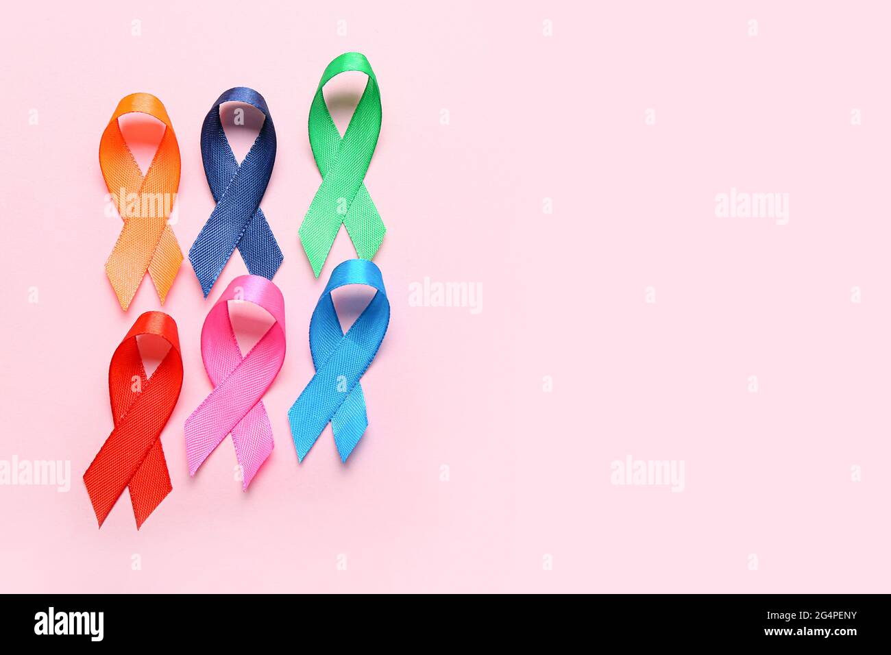 Different awareness ribbons on color background Stock Photo - Alamy