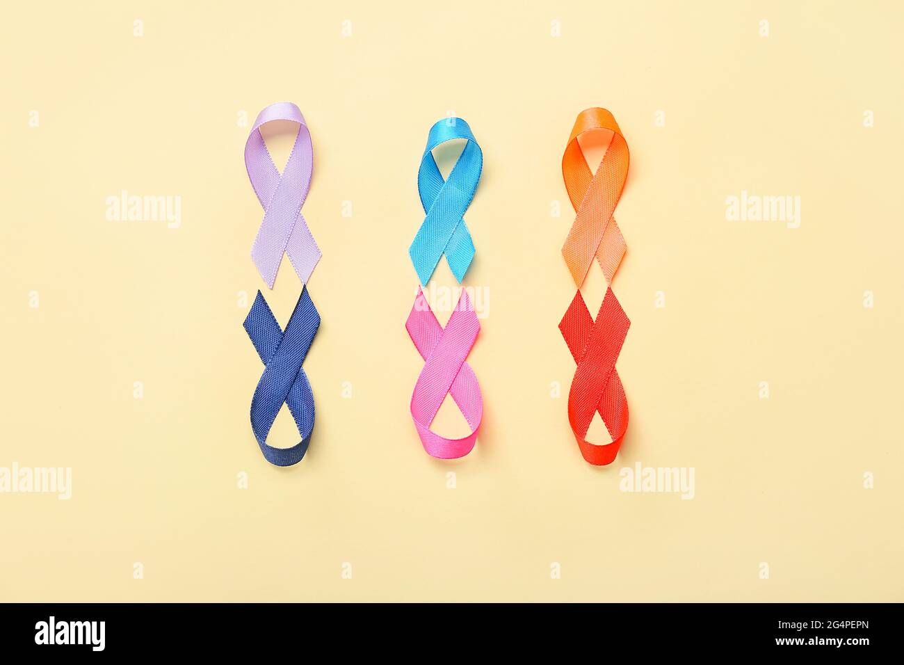 Different awareness ribbons on color background Stock Photo - Alamy