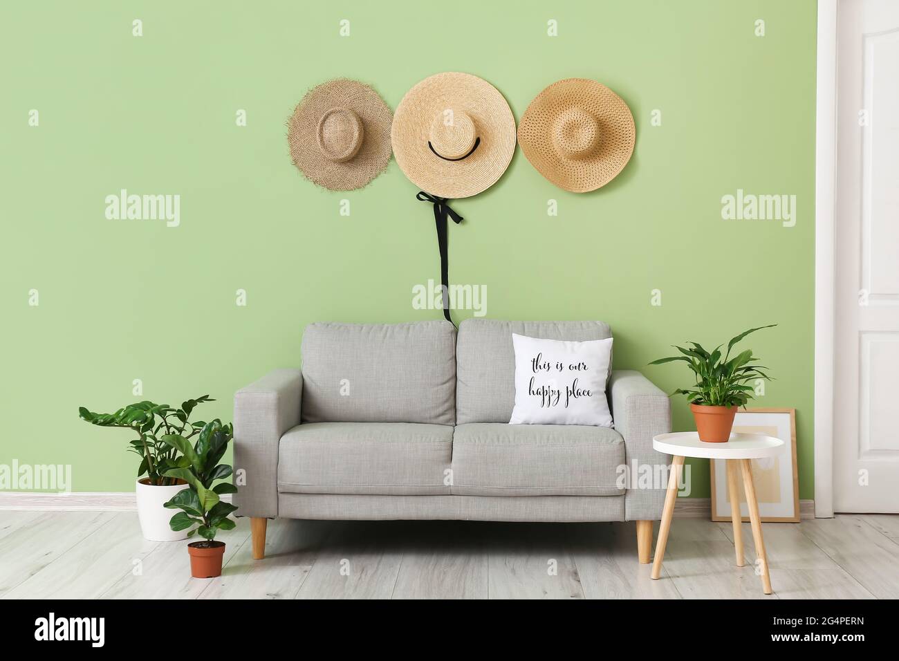 Interior of stylish living room with hats Stock Photo - Alamy