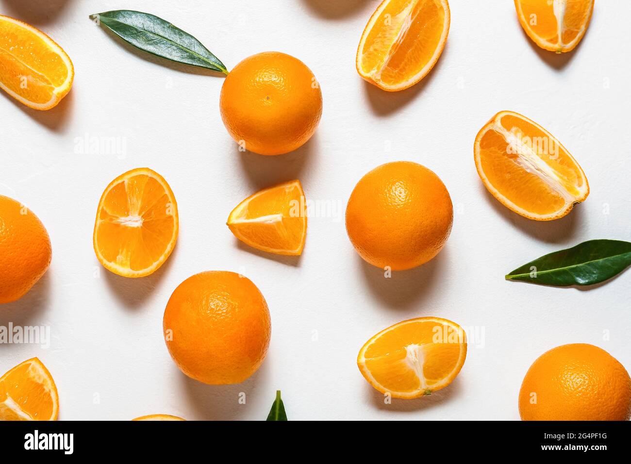 Fresh juicy oranges on light background Stock Photo - Alamy