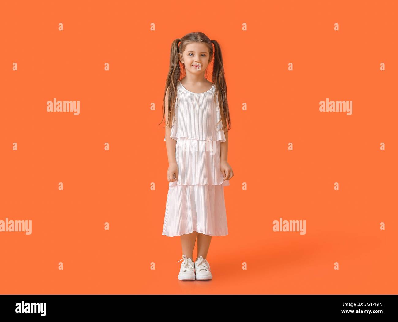Little girl on color background Stock Photo - Alamy