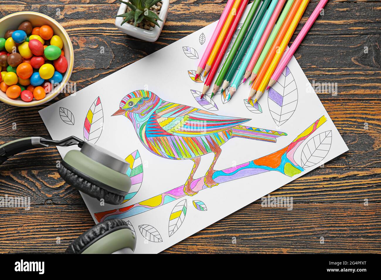 Composition with coloring picture on wooden background Stock Photo - Alamy