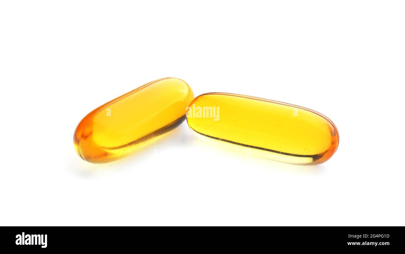 Fish oil capsules on white background Stock Photo - Alamy