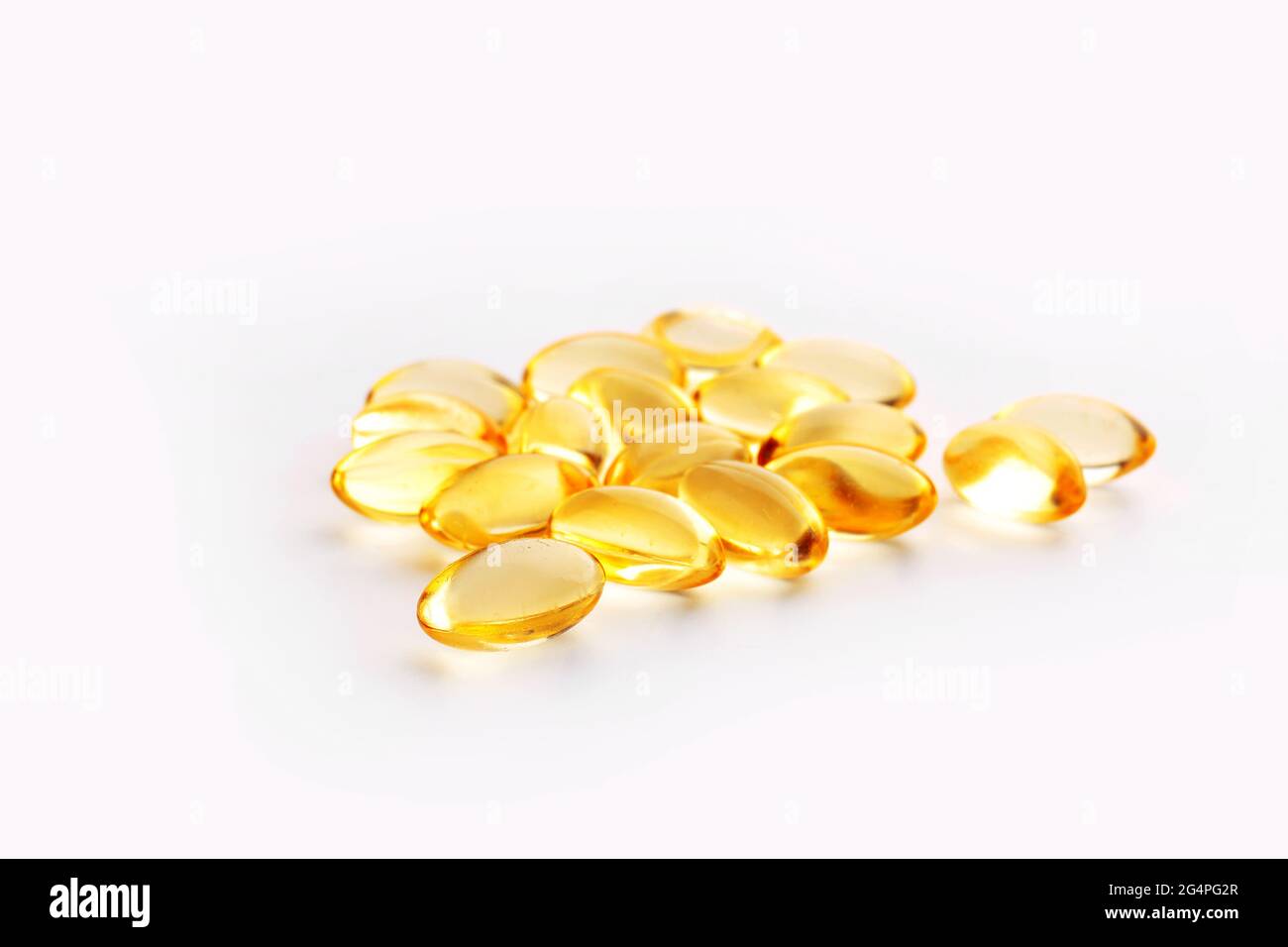 Fish oil capsules on white background Stock Photo - Alamy