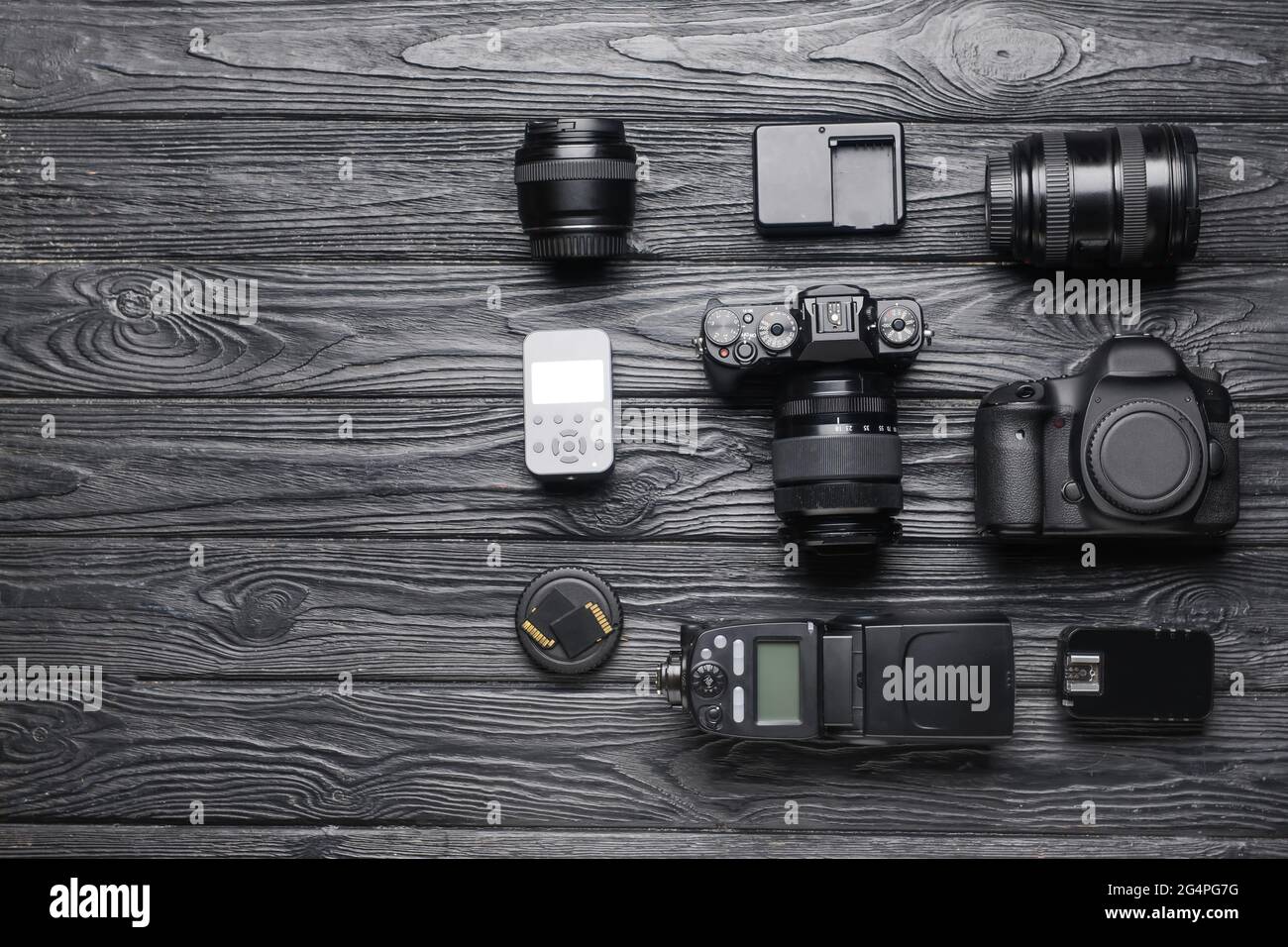 Modern photographer's equipment on dark wooden background Stock Photo ...
