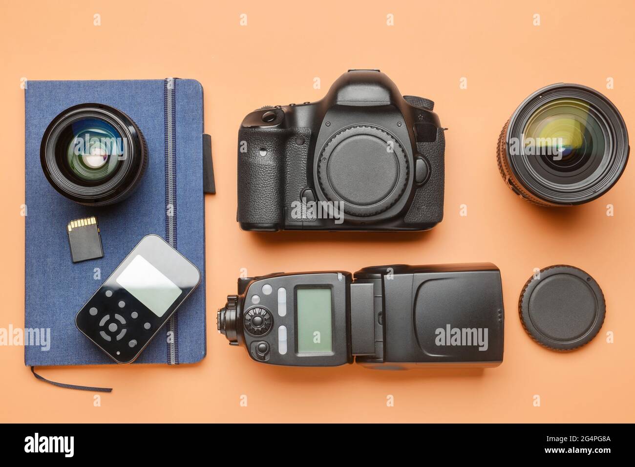 Modern photographer's equipment and notebook on color background Stock ...