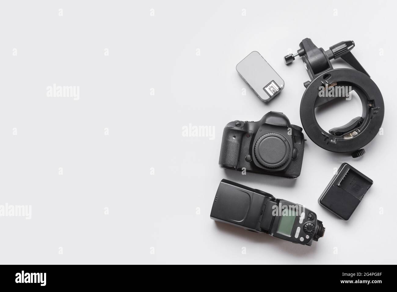 Modern photographer's equipment on light background Stock Photo - Alamy