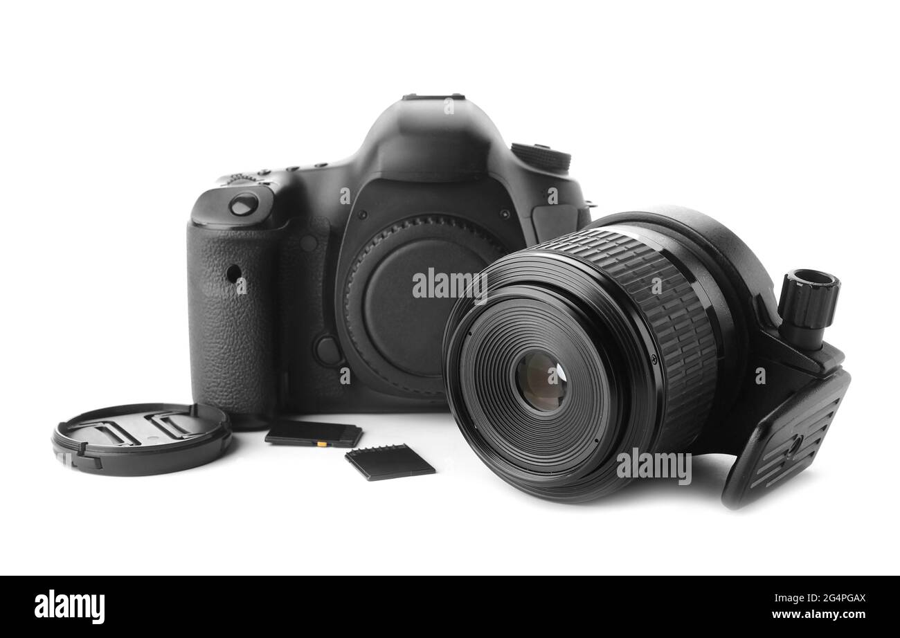 Digital camera, lens and memory cards on white background Stock Photo ...
