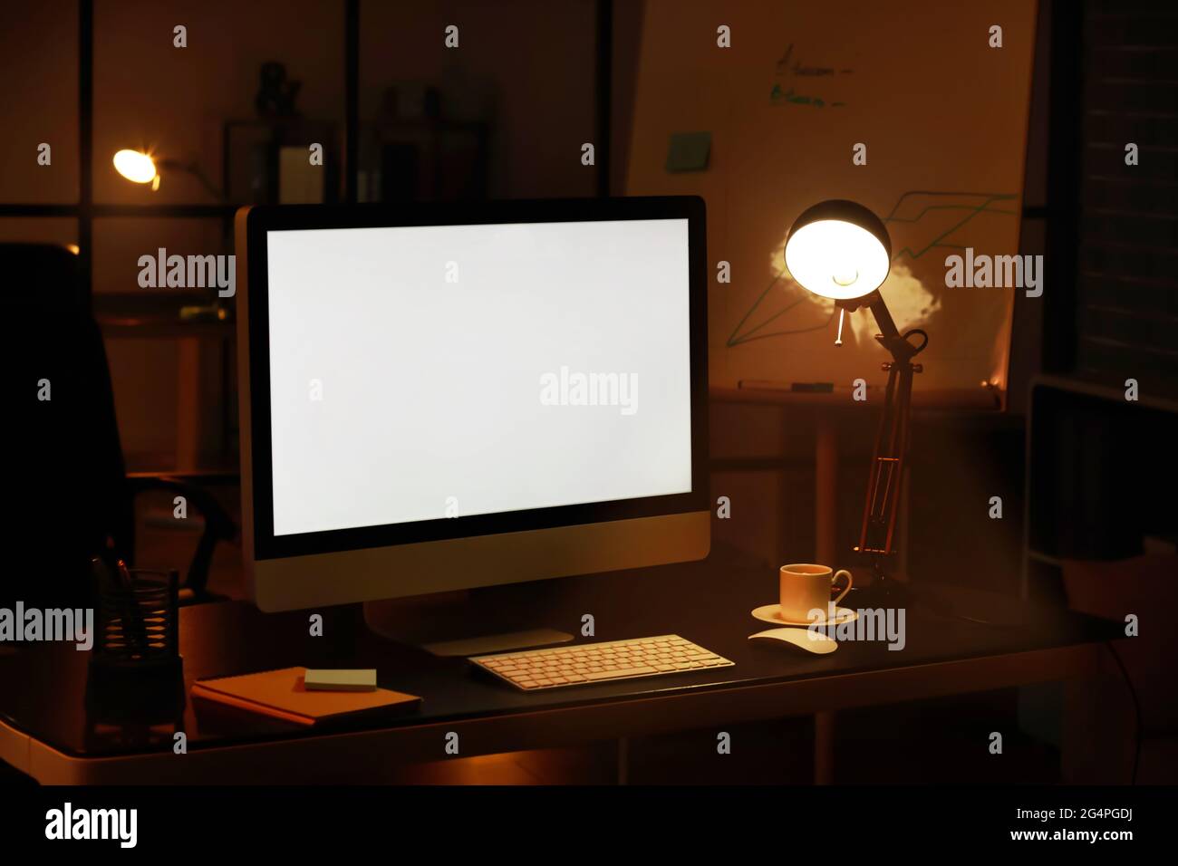 Modern workplace with computer and cup of coffee in room Stock Photo ...