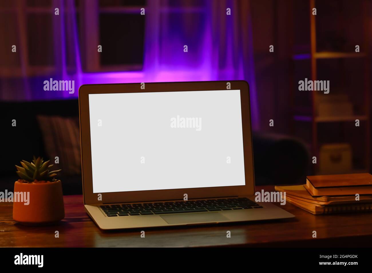 Modern workplace with laptop in room Stock Photo - Alamy