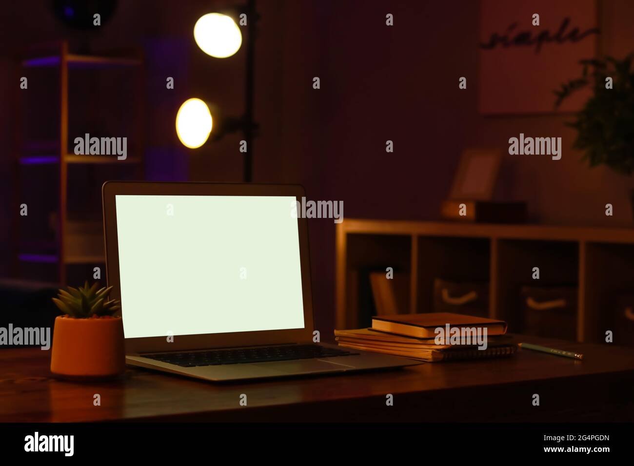 Modern workplace with laptop in room Stock Photo - Alamy