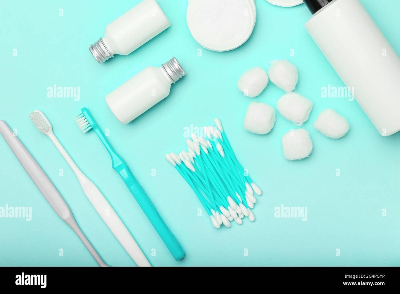 Composition with cotton swabs, balls, pads and toothbrushes on color ...