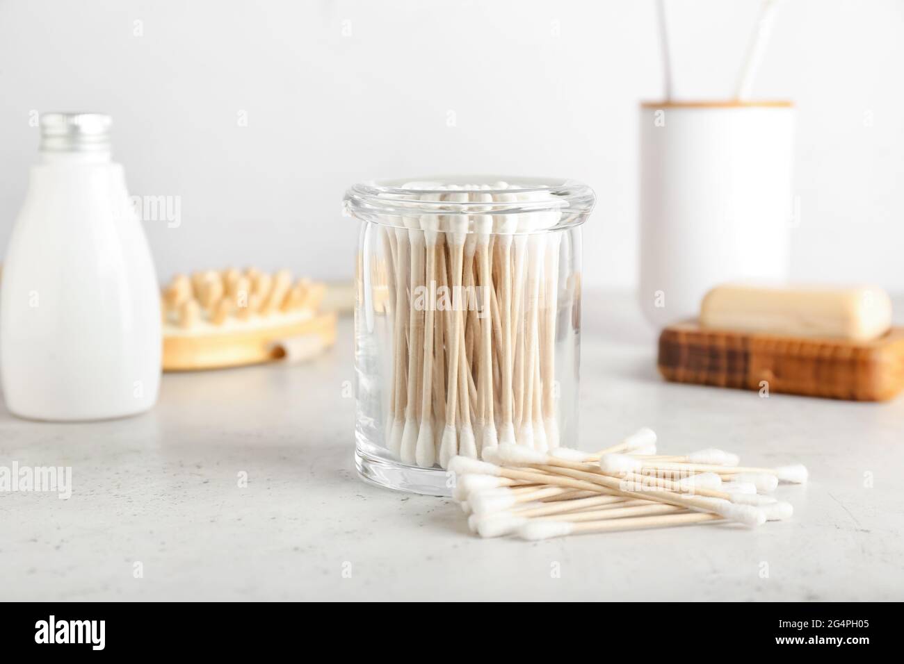 Cotton swabs on light background Stock Photo - Alamy