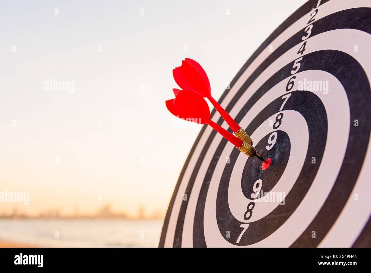 Dart arrow hitting to center on bullseye (bull's-eye) dartboard is the ... Dart arrow hitting to center on bullseye (bull's-eye) dartboard is the ...