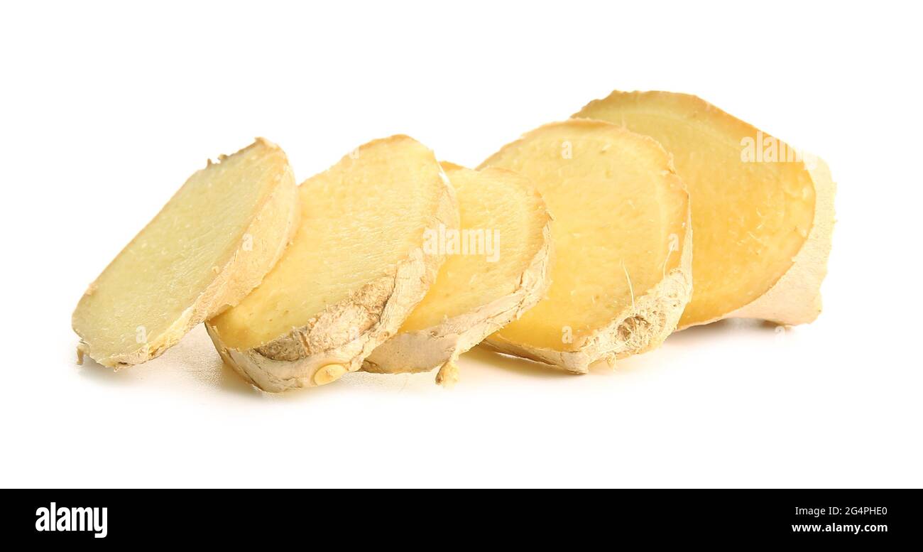 Slices of fresh ginger on white background Stock Photo - Alamy