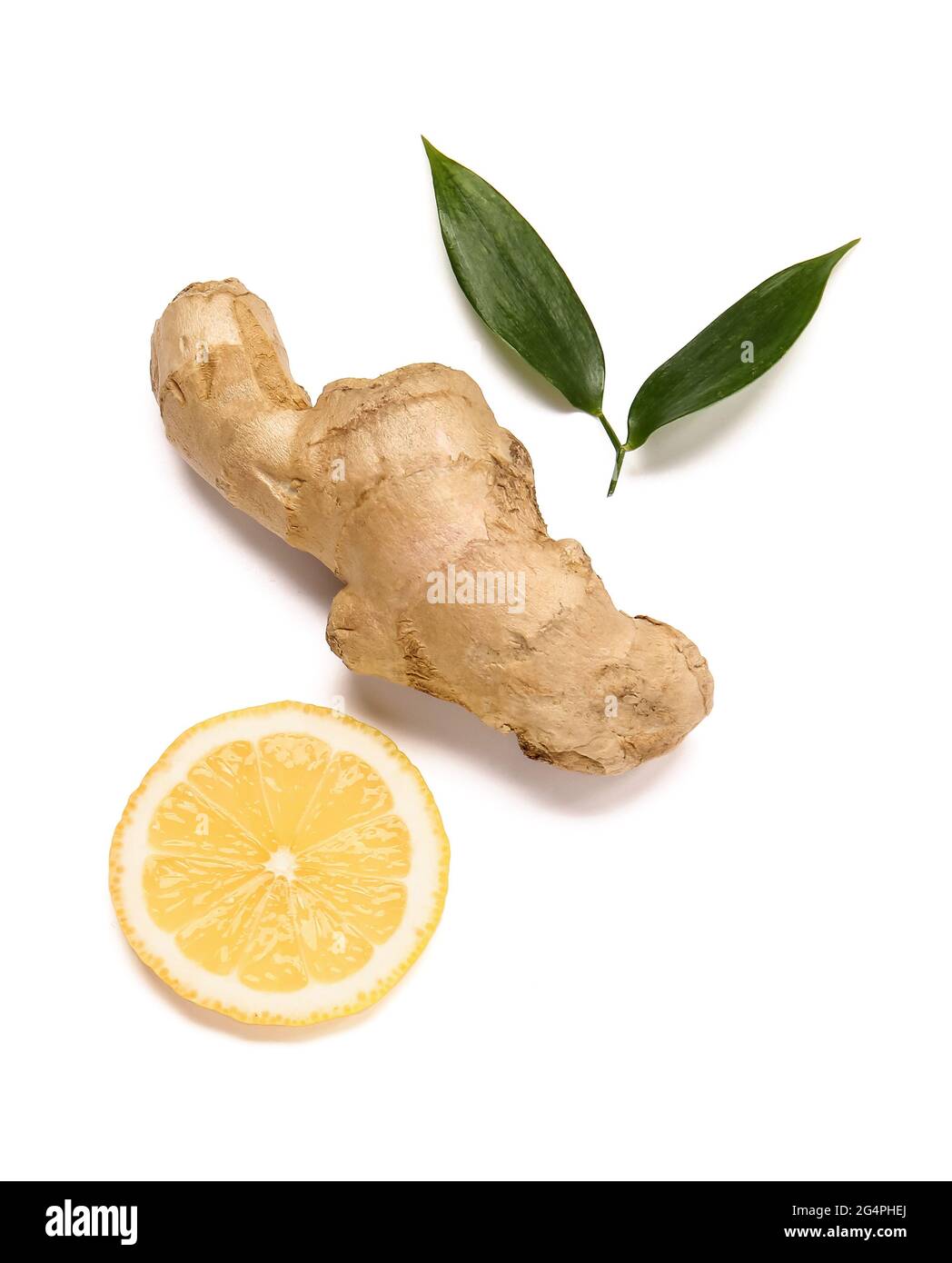 Fresh ginger with lemon on white background Stock Photo - Alamy
