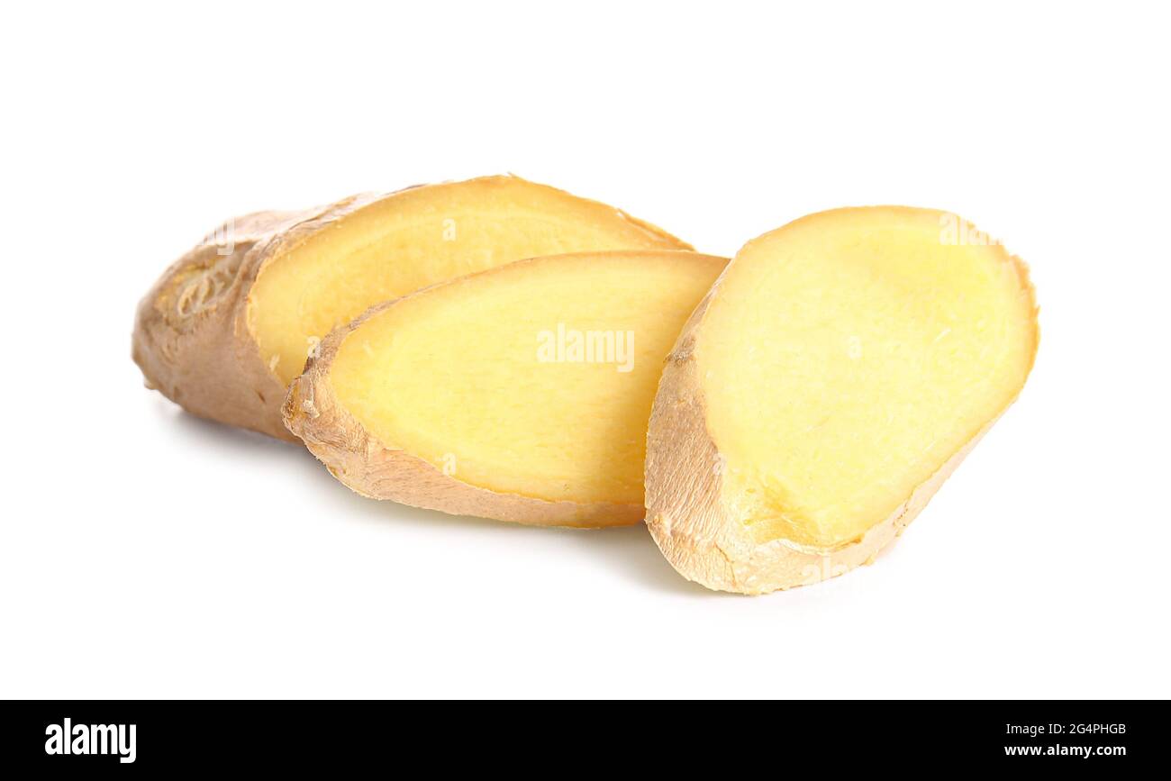Slices of fresh ginger on white background Stock Photo - Alamy