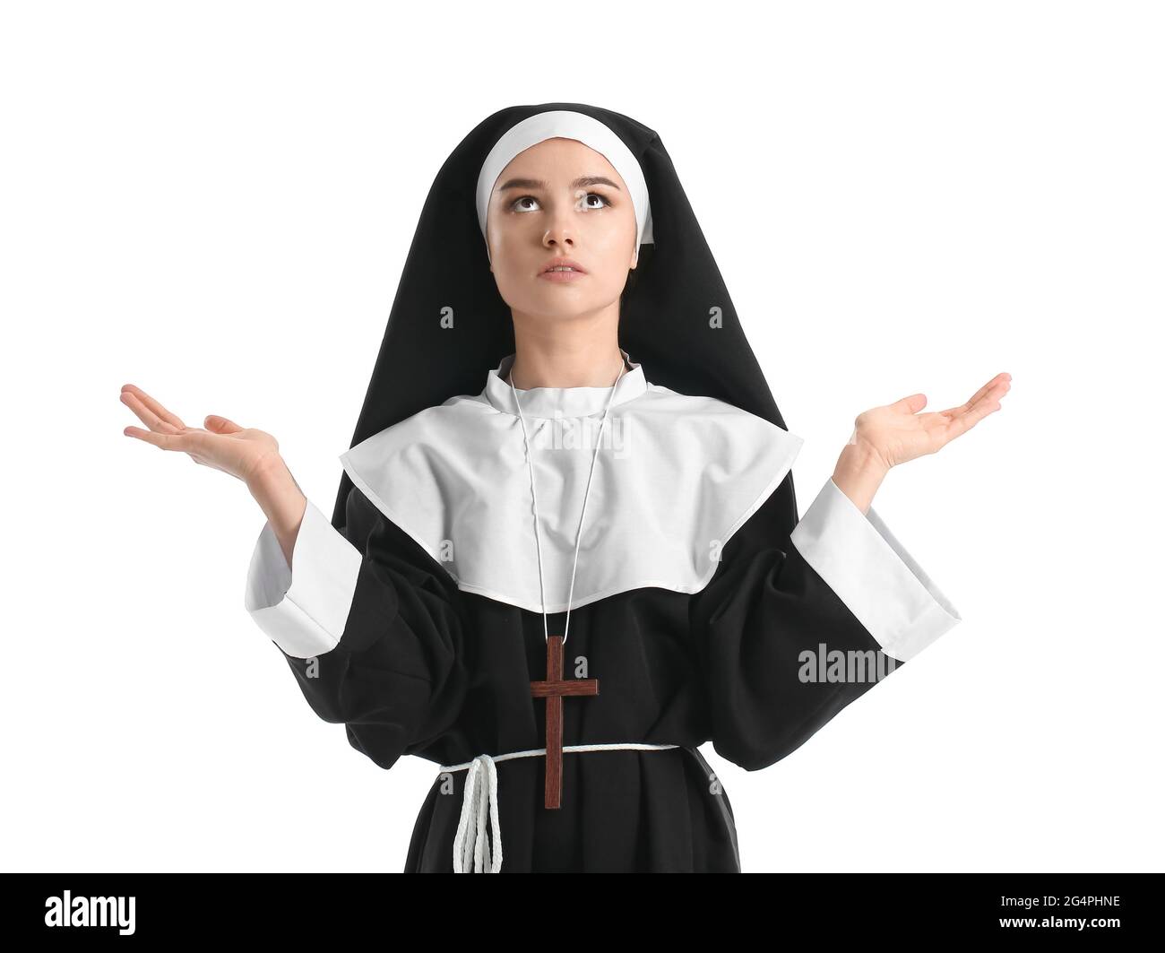 Young praying nun on white background Stock Photo - Alamy