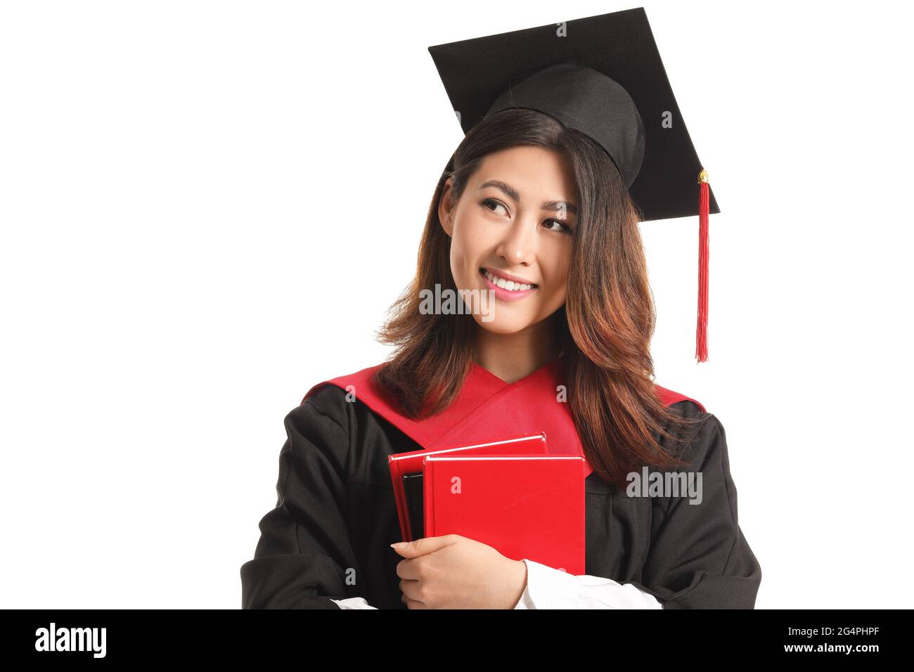Female graduating student with books on white background Stock Photo ...