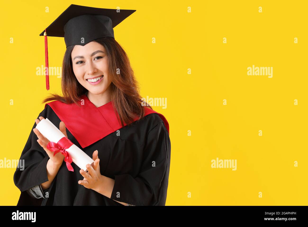 Female graduating student with diploma on color background Stock Photo ...