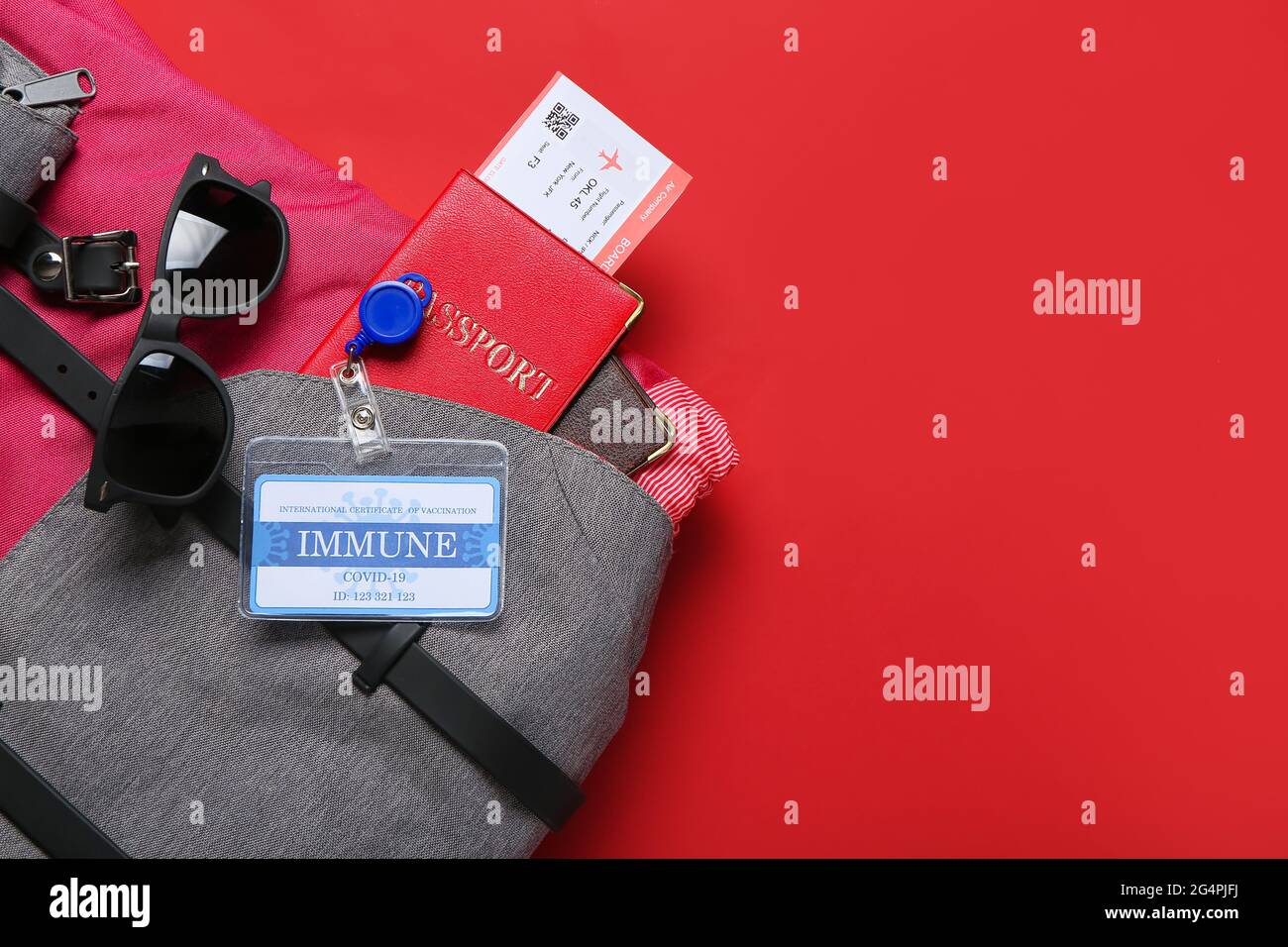 Bag with immune card, passport and ticket on color background Stock ...