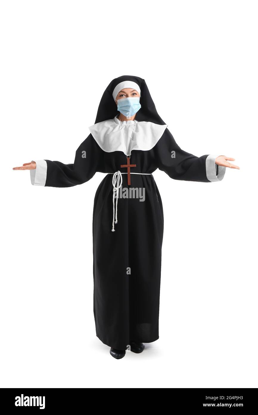 Mature nun in medical mask on white background Stock Photo - Alamy