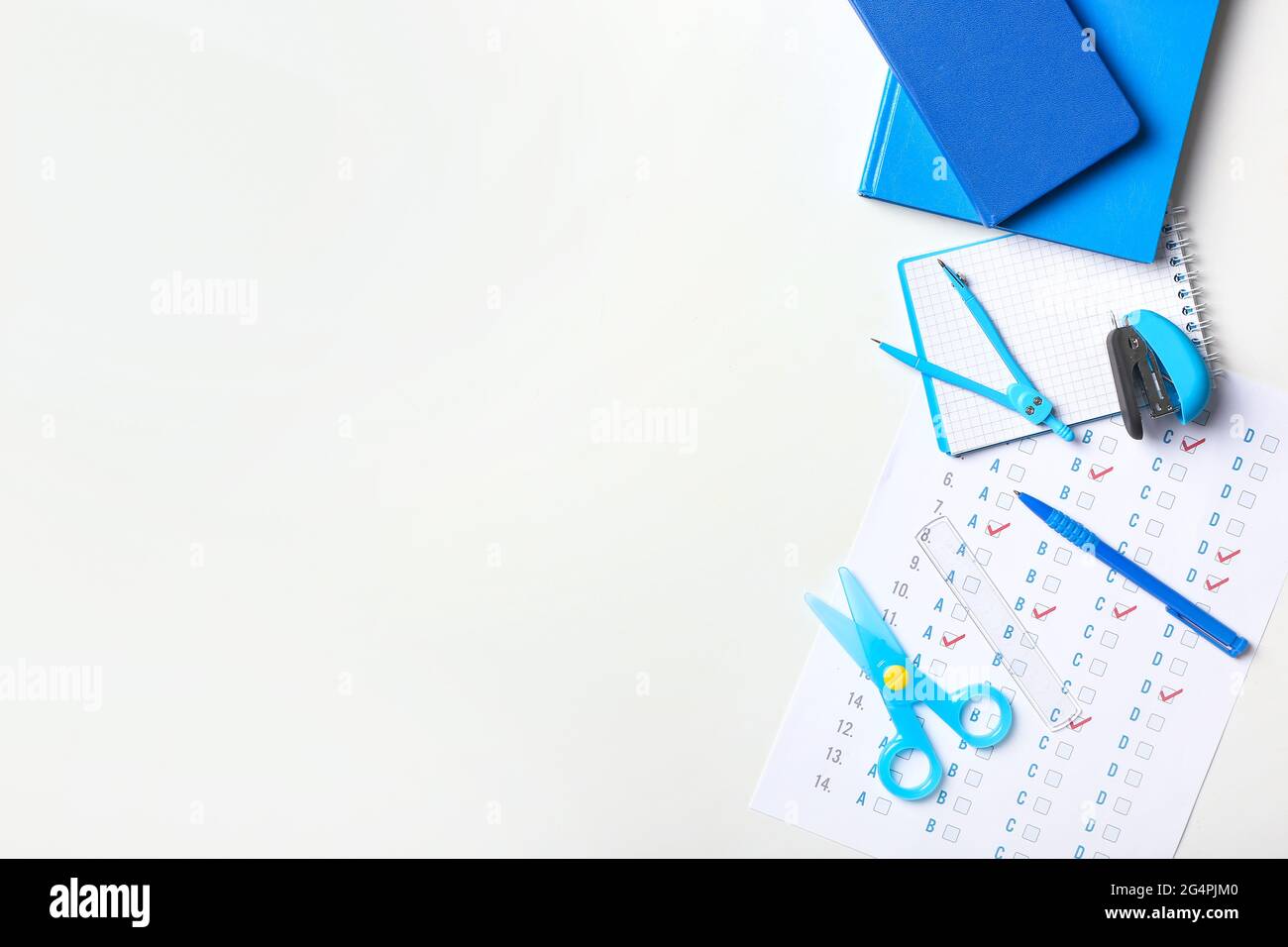 Answer sheet and stationery on white background Stock Photo - Alamy