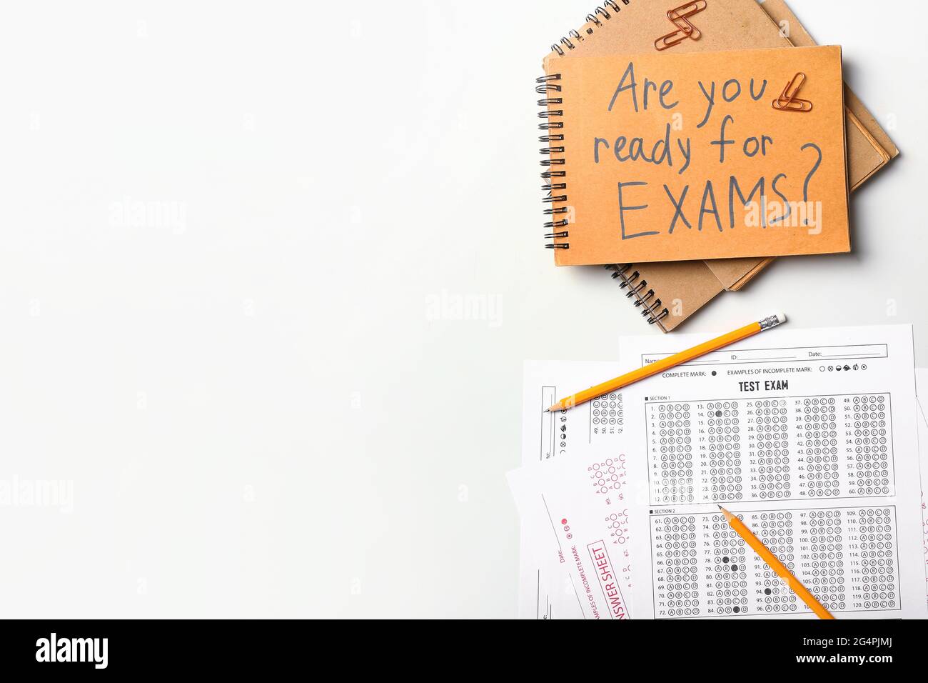 Stationery, answer sheets and notebook with text ARE YOU READY FOR ...