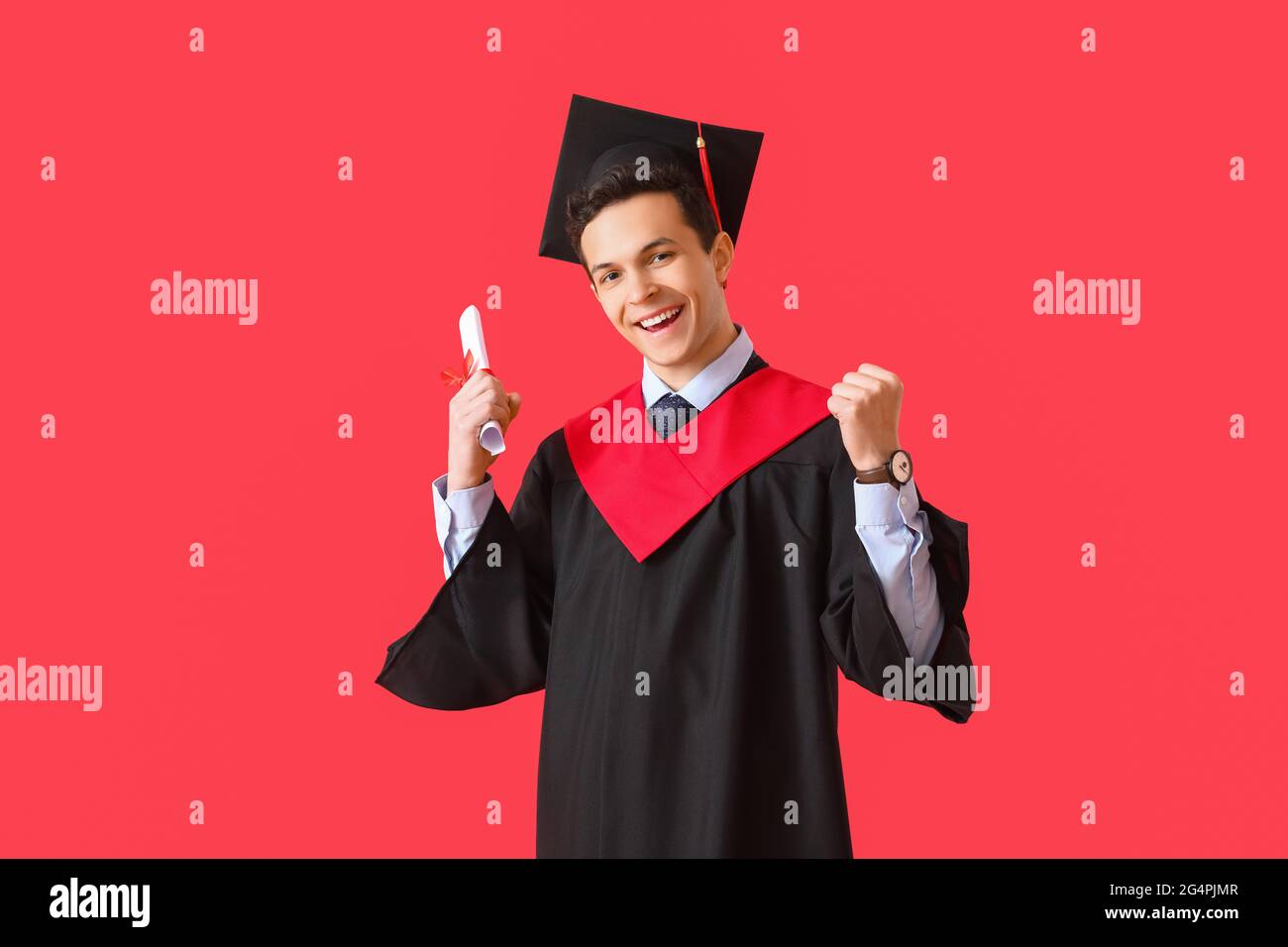 Happy graduating student on color background Stock Photo - Alamy