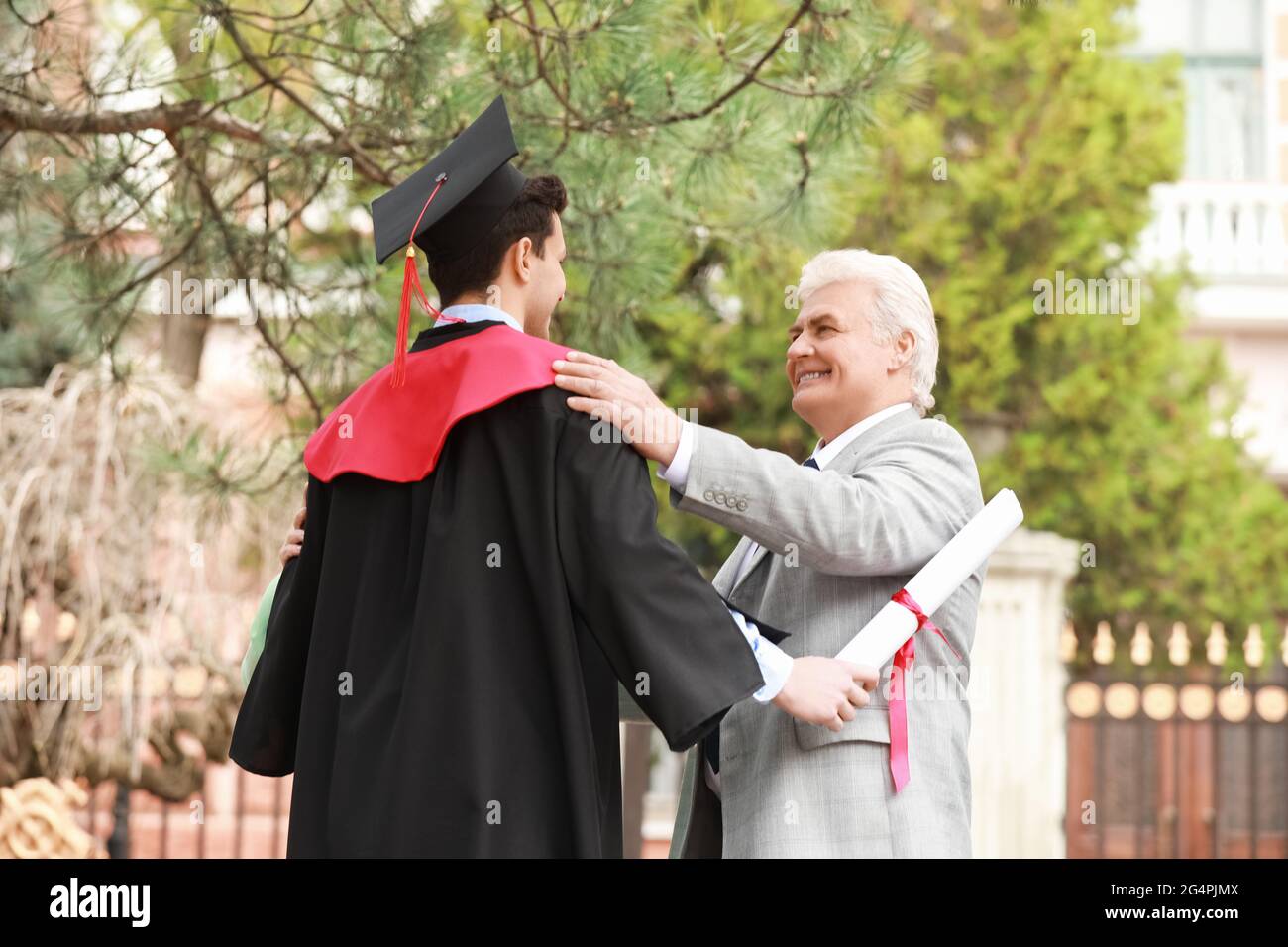 Happy young man with his father on graduation day Stock Photo - Alamy